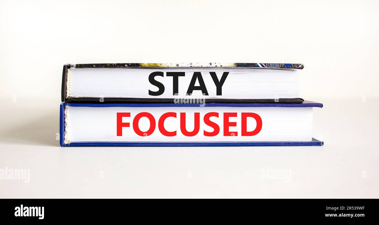 Stay focused symbol. Concept words Stay focused on beautiful books on a ...