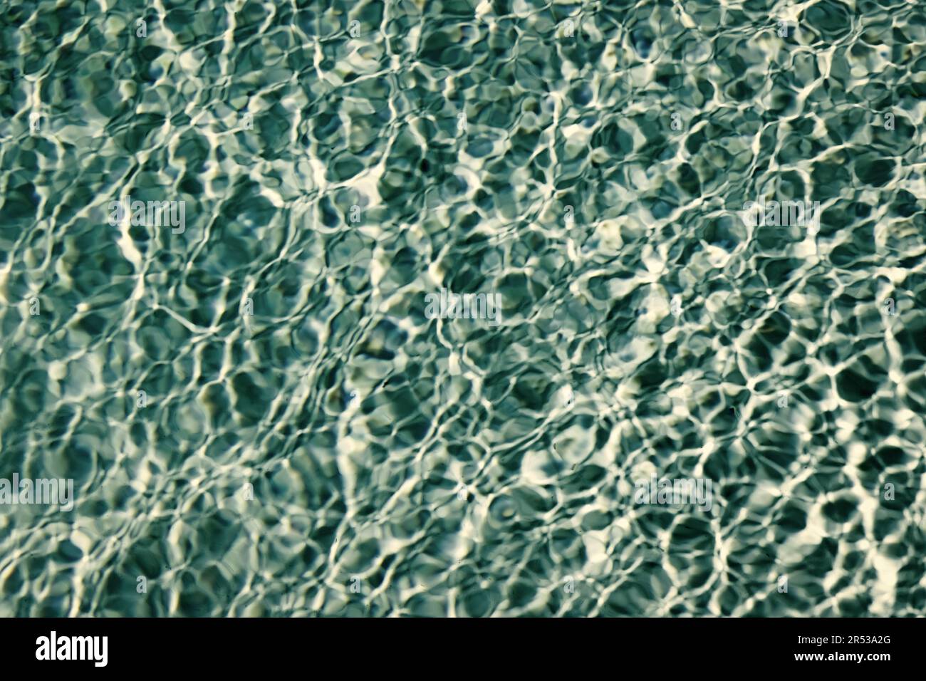 rippled water turquoise color in summertime swimming pool Stock Photo ...