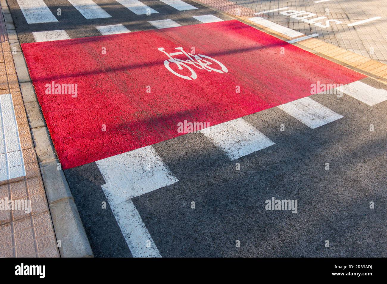 Crossroads in the city. Bike path next to pedestrian crossing on street ...