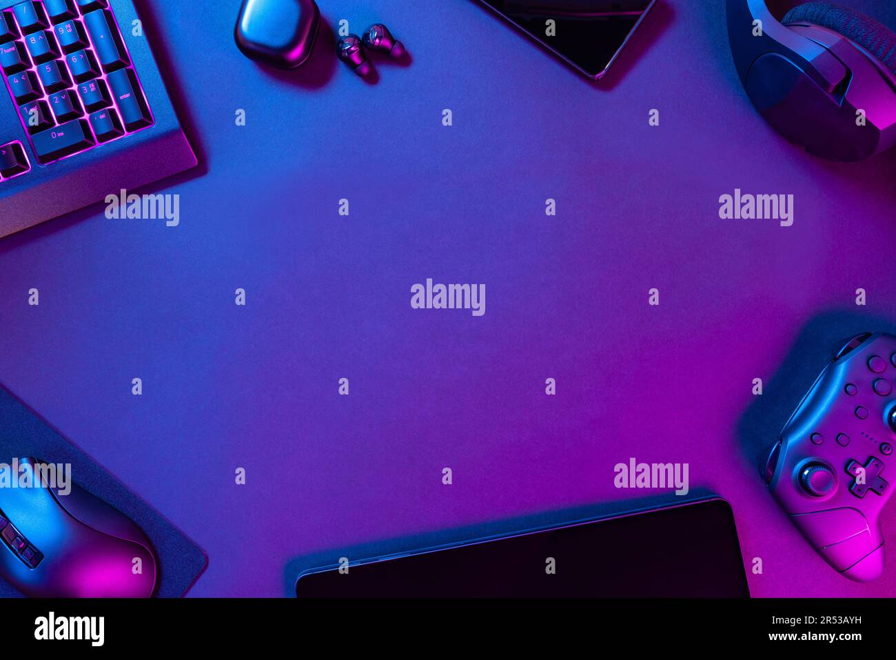 Various modern wireless gadgets on illuminated desk Stock Photo - Alamy