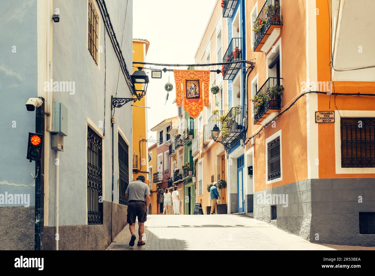 View to beautiful Villajoyosa street with multi-colored houses ...