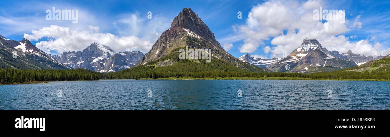 Spring at Swiftcurrent Lake - Panoramic view of Swiftcurrent Lake, with ...