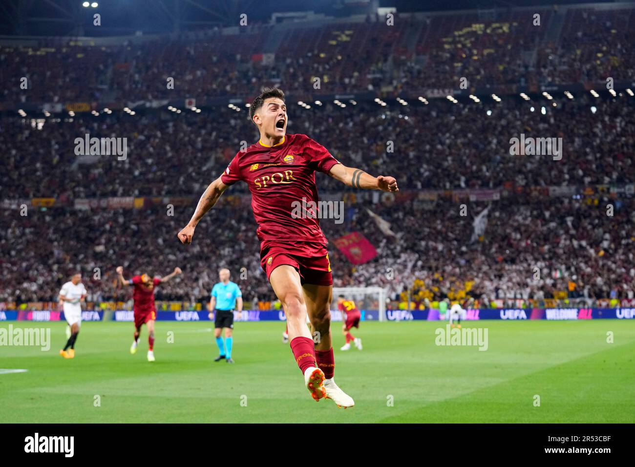 Roma's Paulo Dybala celebrates after scoring the opening goal during ...