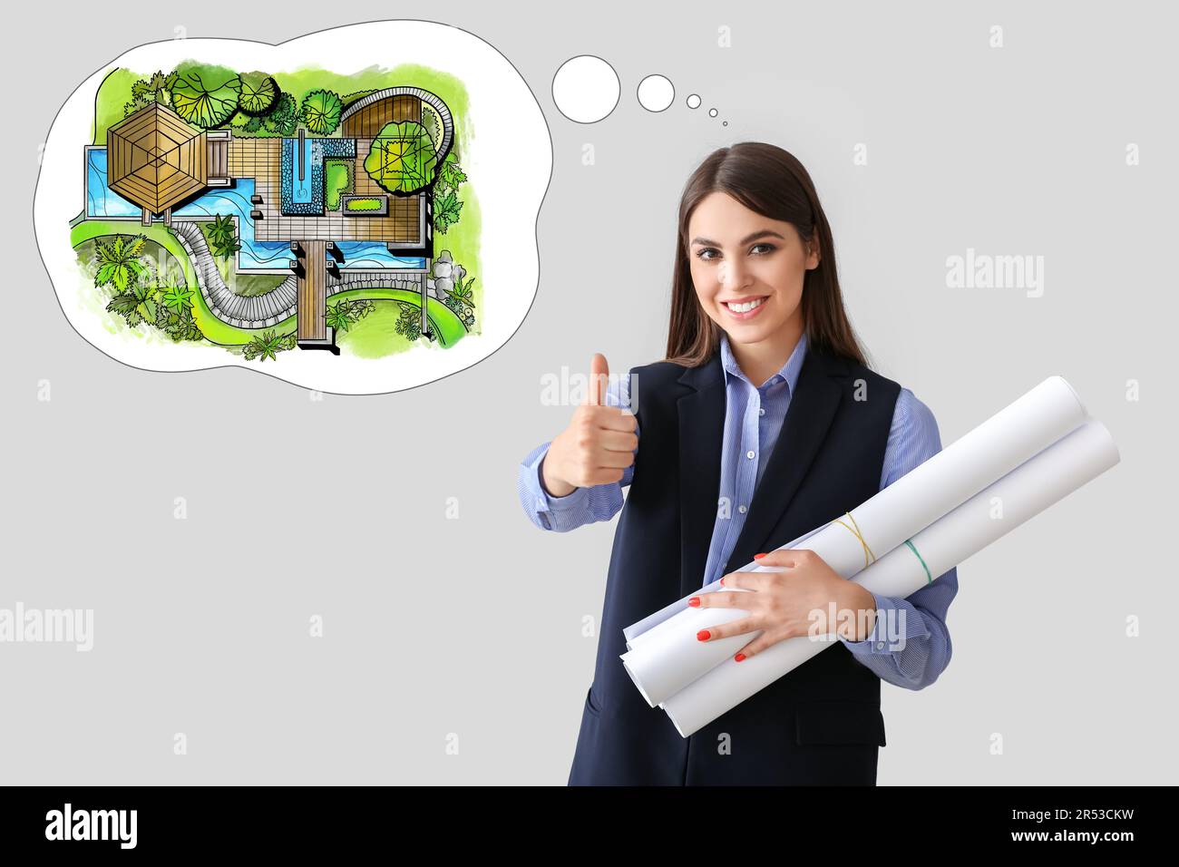 Female landscape designer with drawings on grey background Stock Photo ...