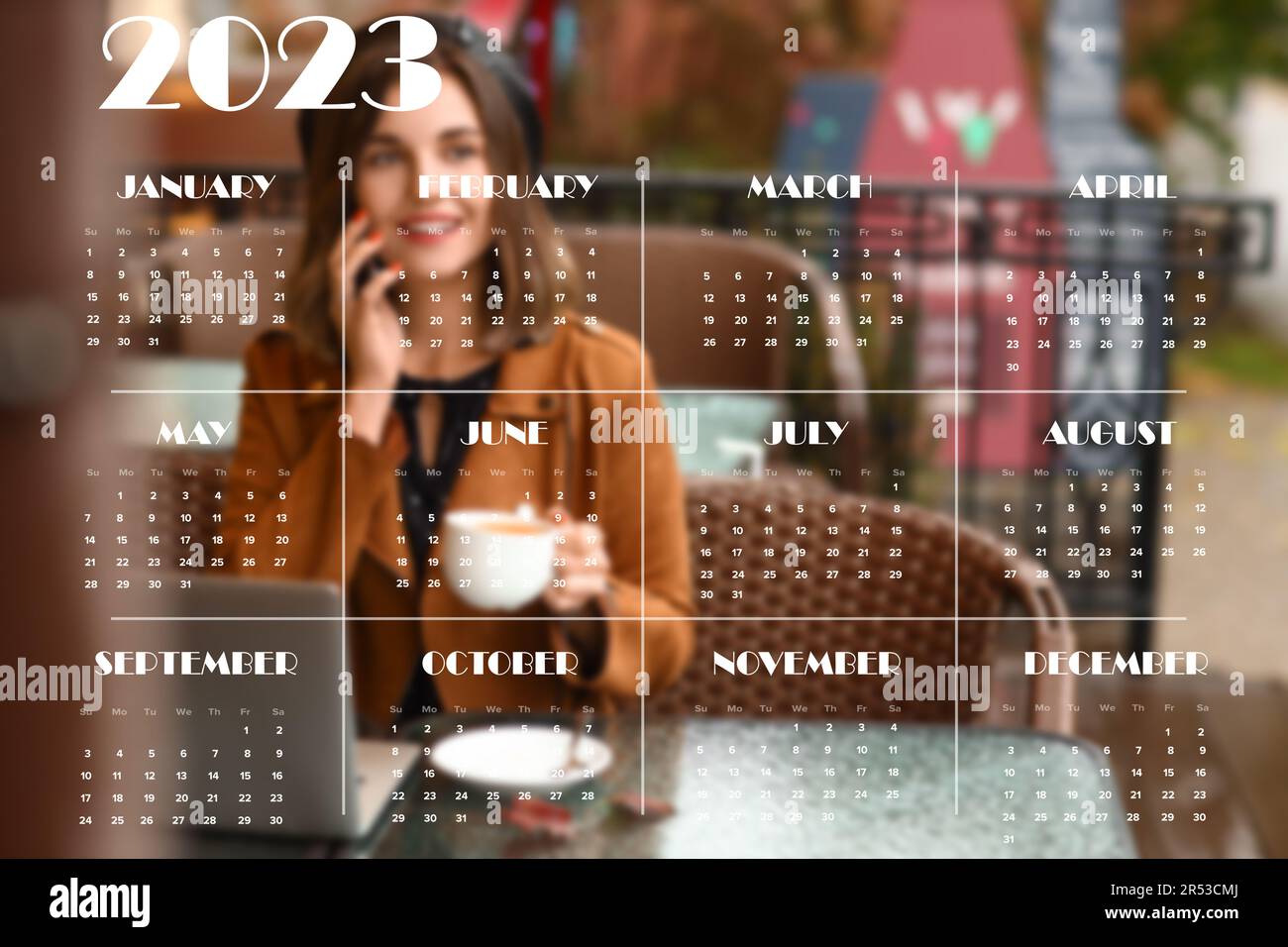 Transparent year 2023 calendar and young woman in cafe Stock Photo - Alamy