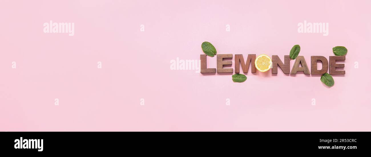 Word LEMONADE with mint and lemon on pink background with space for ...