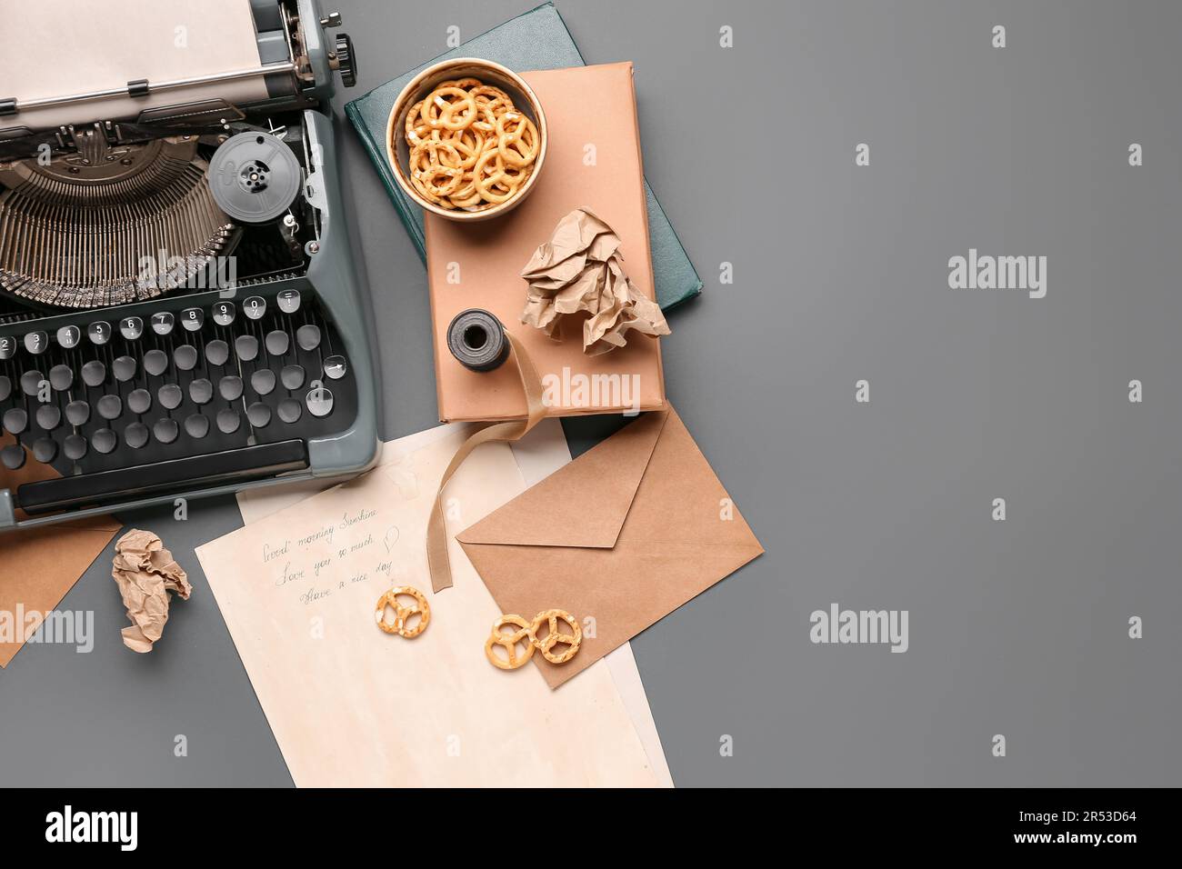 Composition with vintage typewriter, letter, envelope, crumpled paper ...