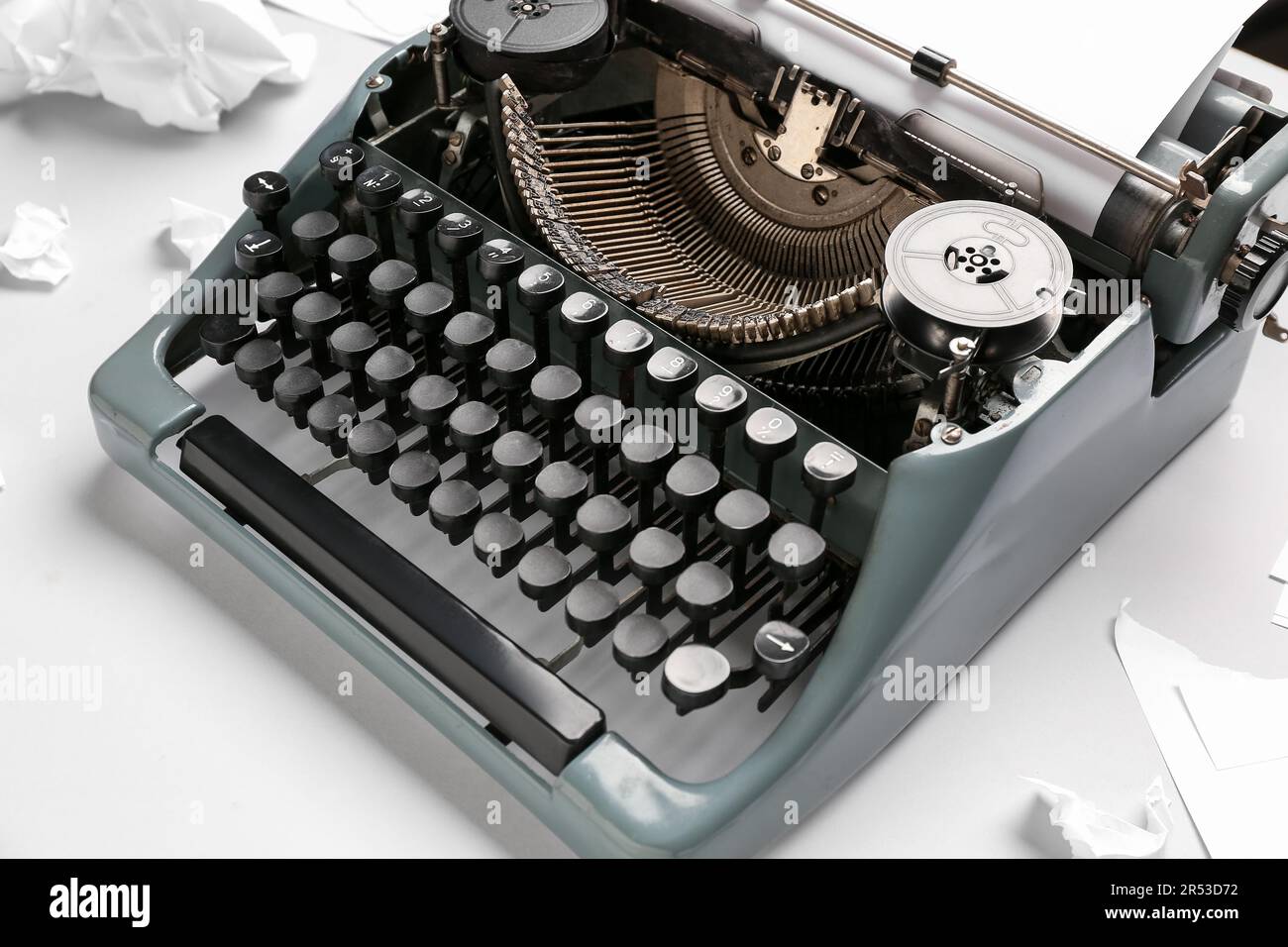 Vintage typewriter and paper pieces on white background Stock Photo - Alamy