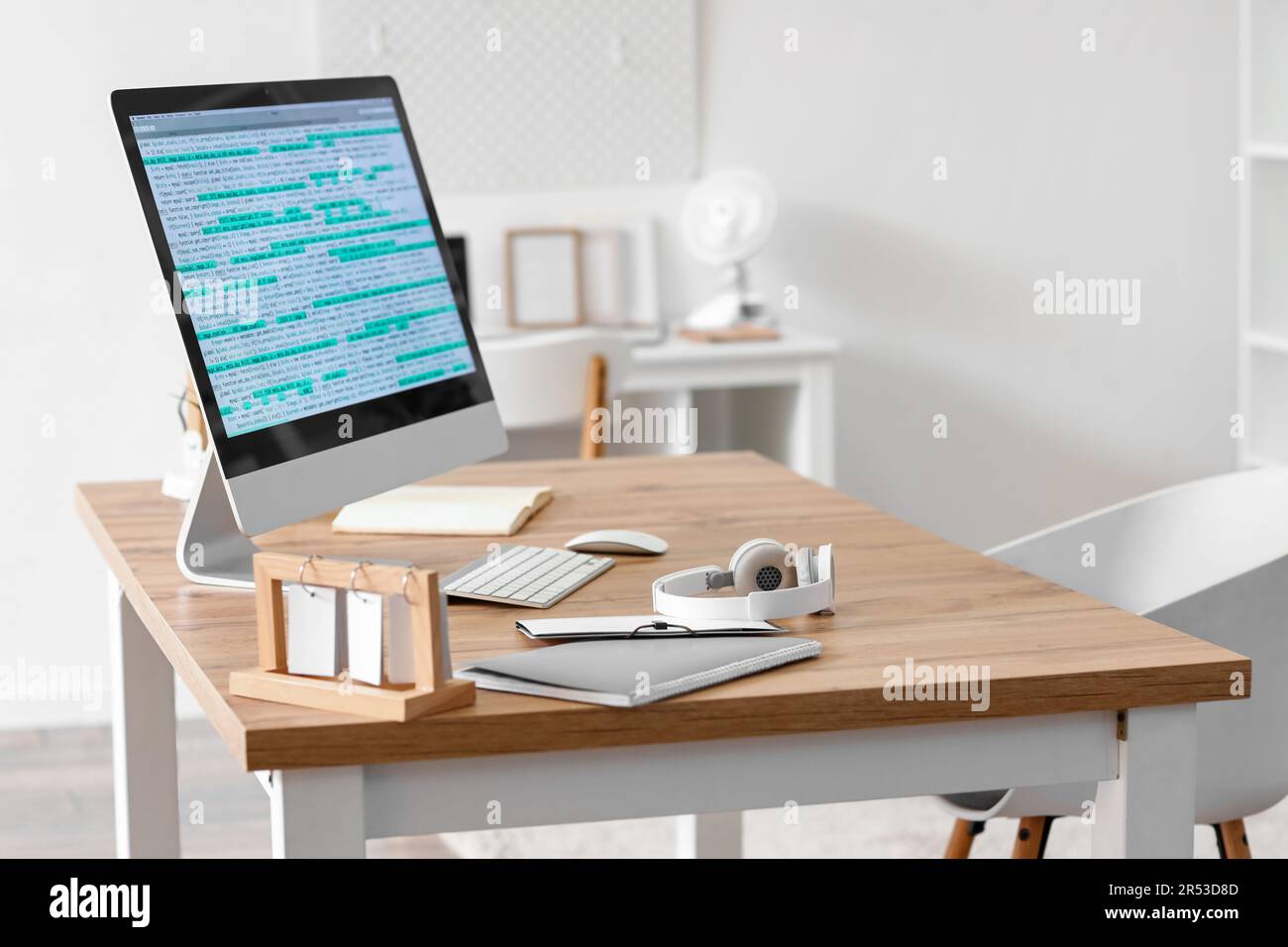 Programmer's workplace with computer in light office Stock Photo - Alamy