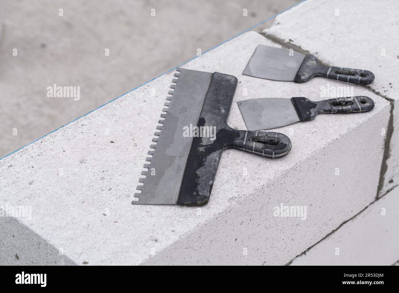 Aerated Concrete block and three Spatulas. Foam Concrete masonry ...