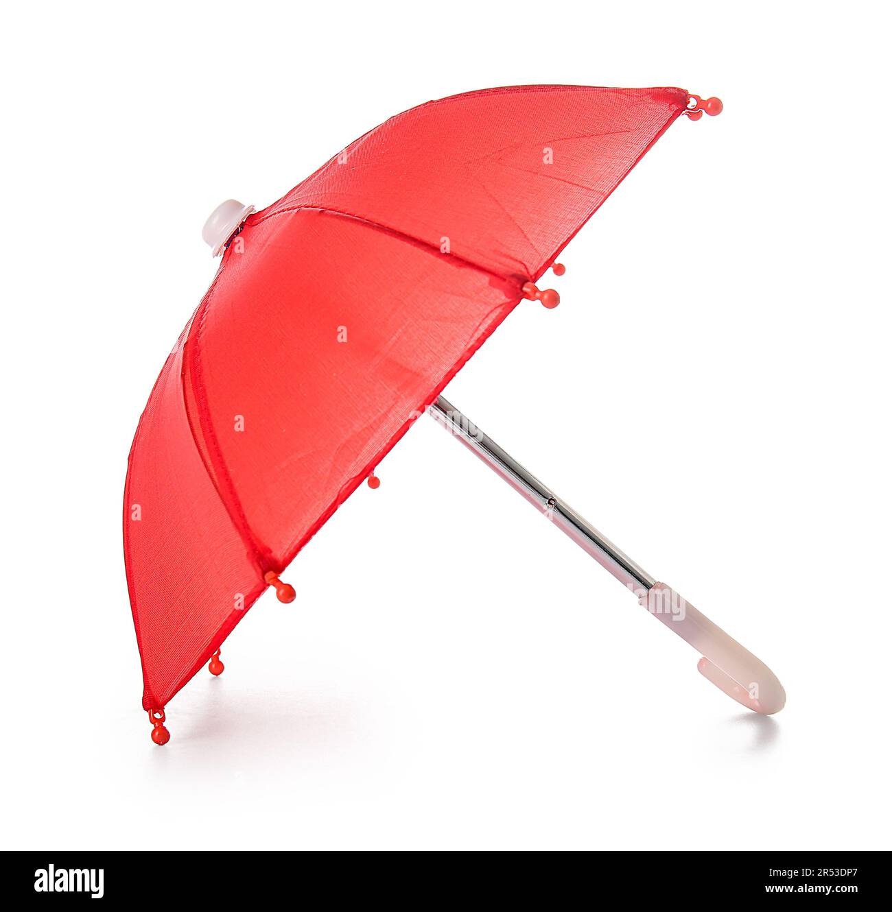 Mini red umbrella on white background Stock Photo - Alamy