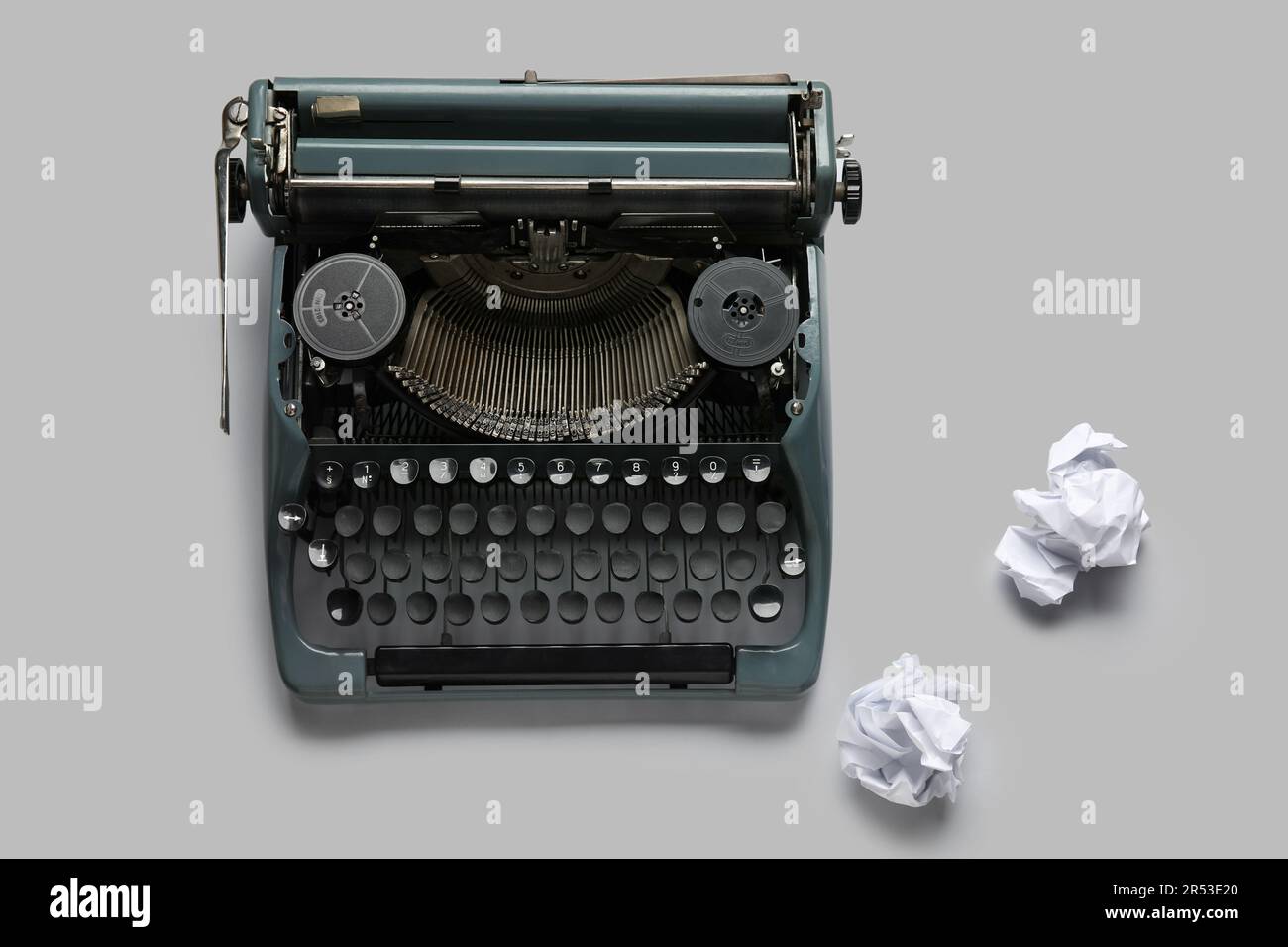 Vintage typewriter with crumpled paper on white background Stock Photo ...
