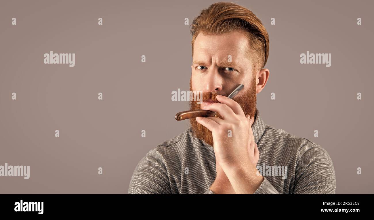 man hold barber blade for shaving. man shaving with barber blade ...