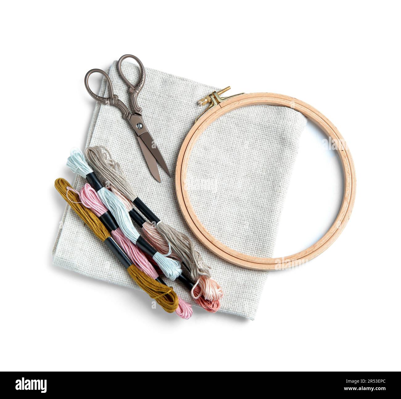 Wooden embroidery hoop with canvas, scissors and moulin threads ...