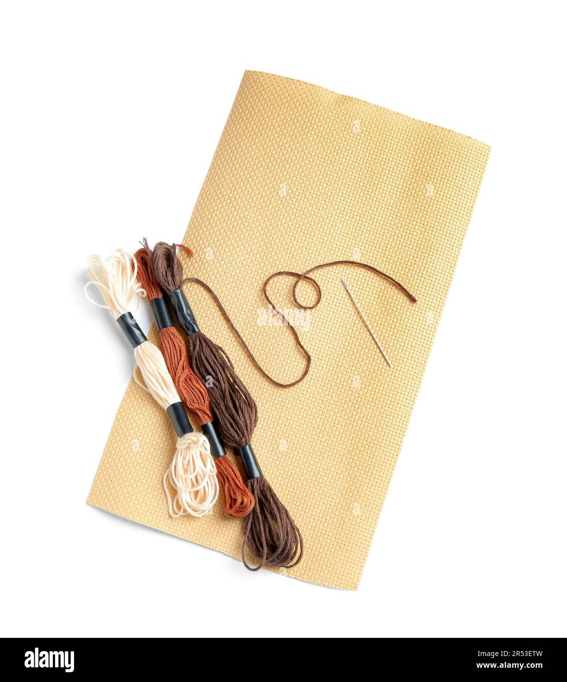 Canvas for sewing with moulin threads and needle isolated on white ...