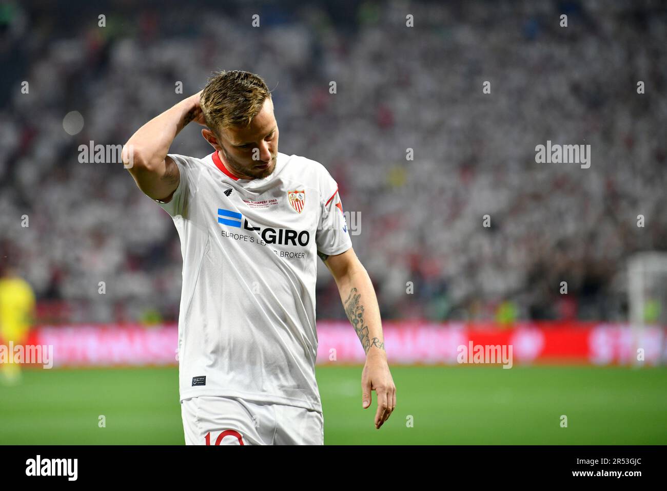 Sevilla's Ivan Rakitic leaves the field at the end of the first half ...
