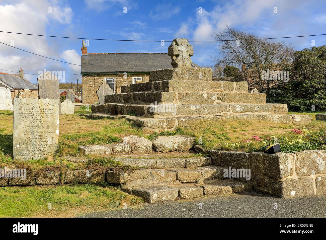 An old stone cross in the grave yard or cemetery of the parish Church ...