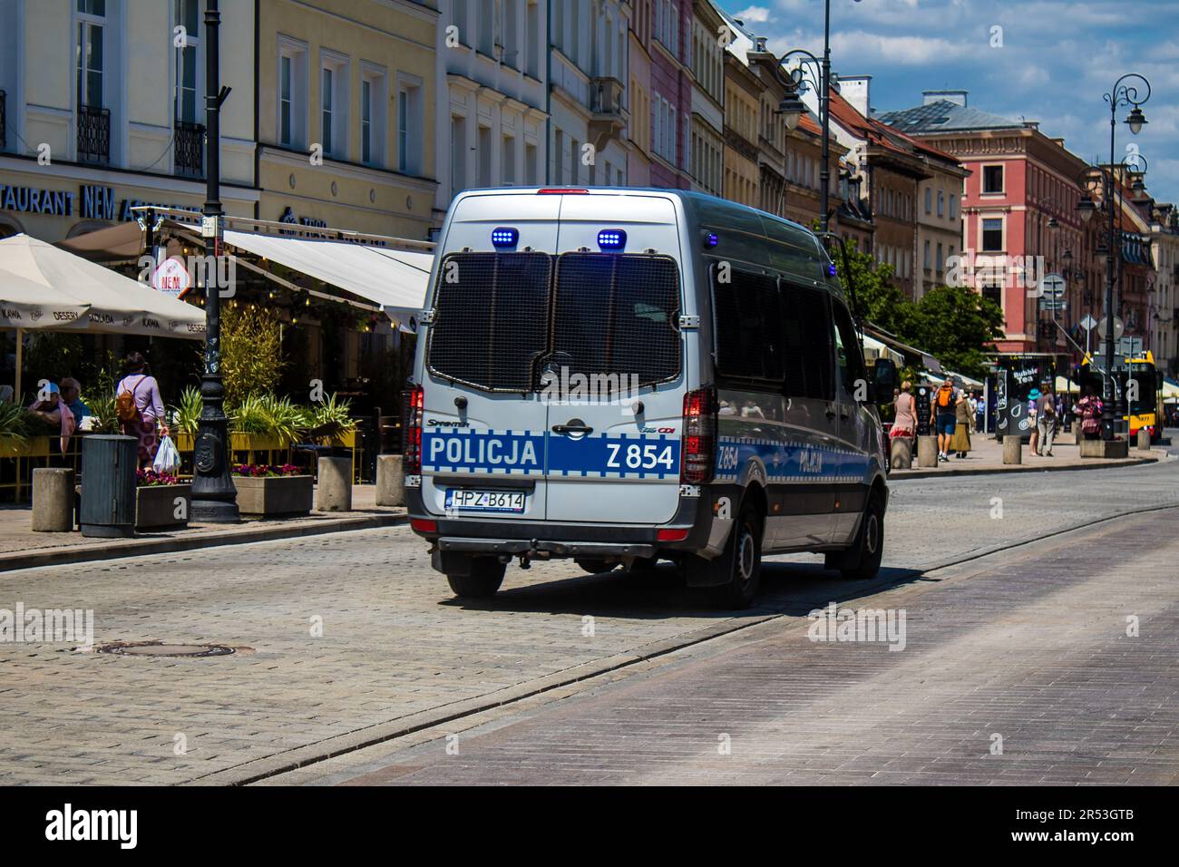 Warsaw, Poland - May 28, 2023 Police car driving in the city center of ...