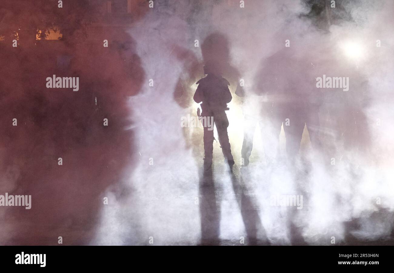 Leipzig, Germany. 31st May, 2023. Police officers in the pyro fog at a ...