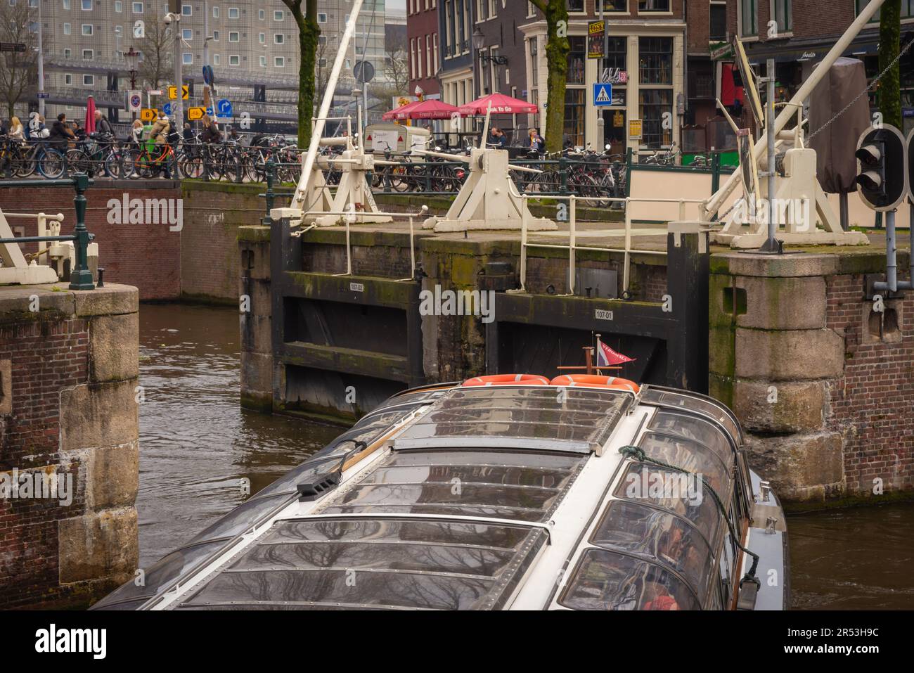 Cruising boat sail through canals of Amsterdam, Netherlands Stock Photo ...