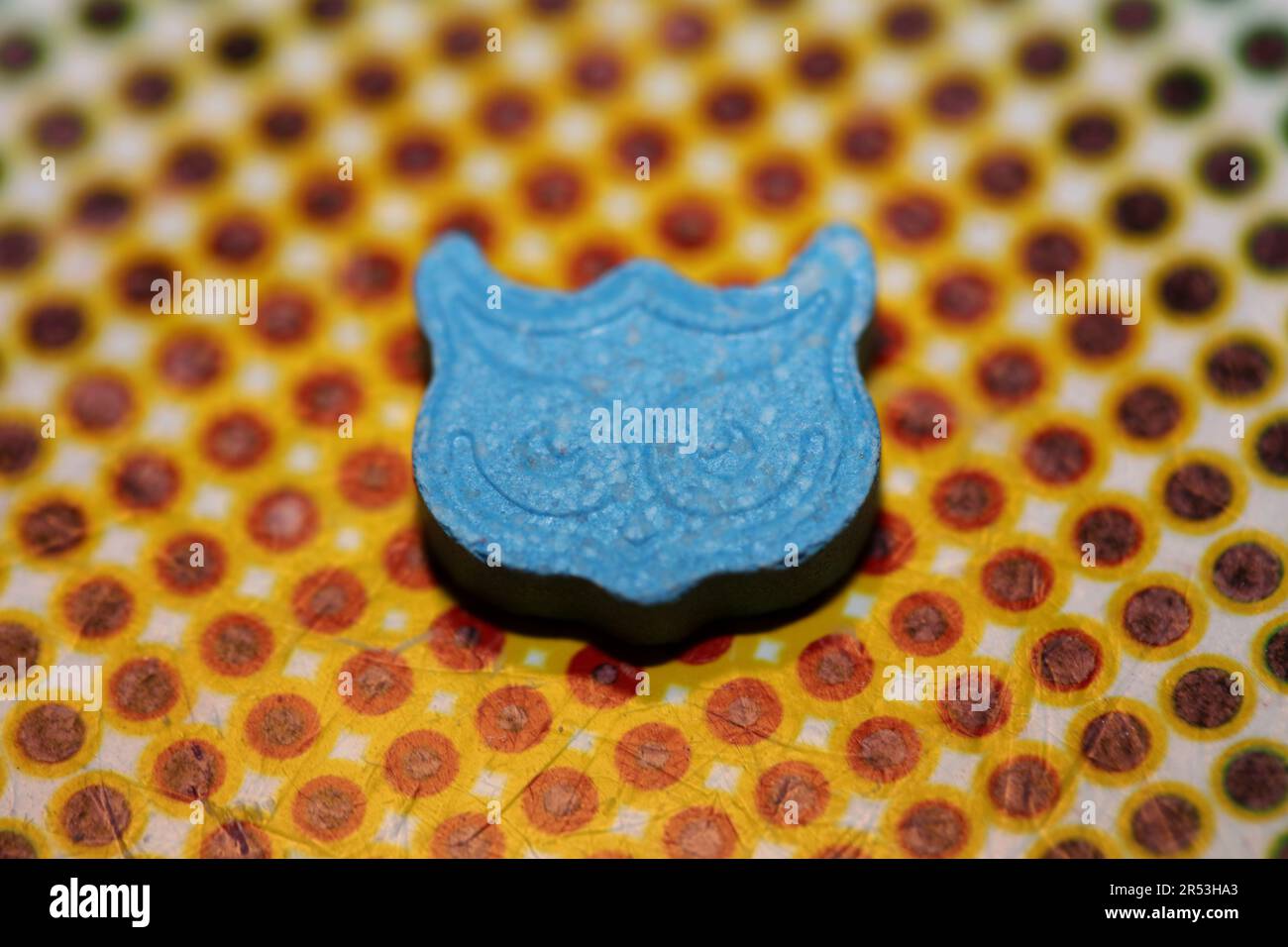 Blue ecstasy owl pill with mdma very strong dope close up background ...