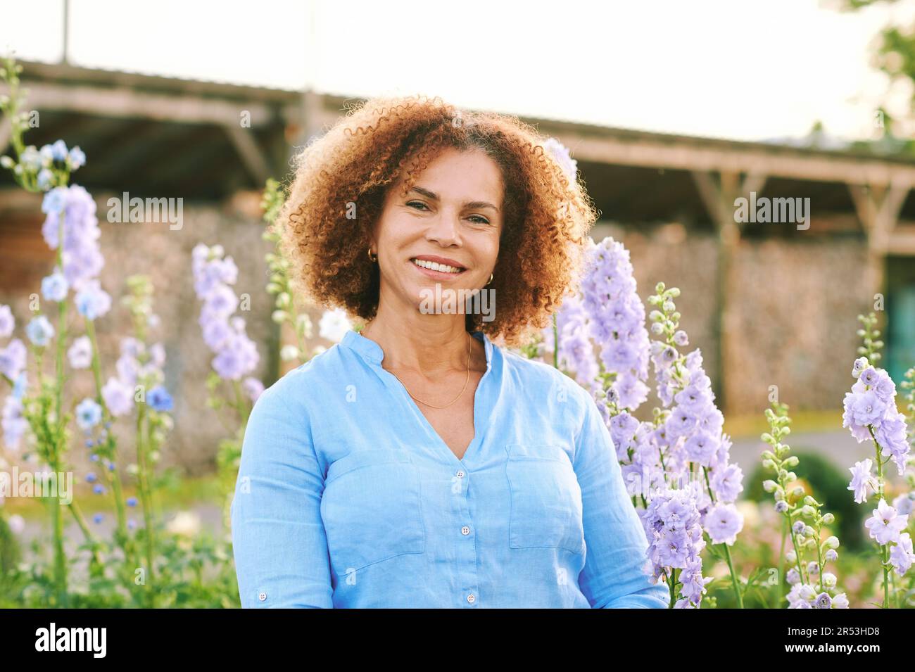 Outdoor Portrait Of Beautiful 50 Year Old Woman Enjoying Nice Day In