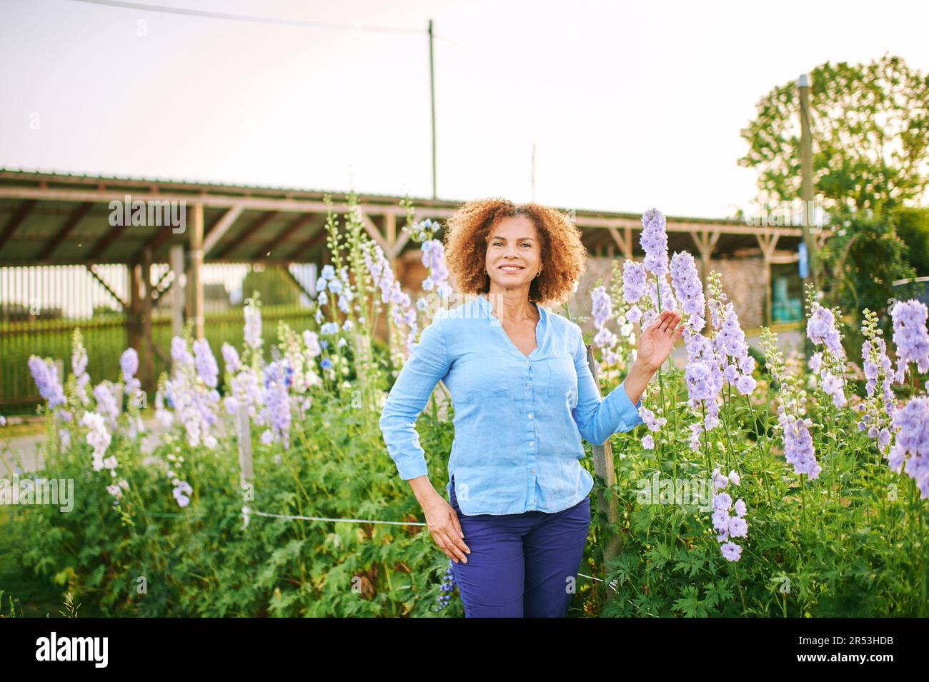 Outdoor Portrait Of Beautiful 50 Year Old Woman Enjoying Nice Day In