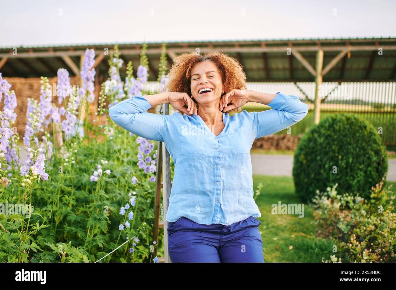 Outdoor Portrait Of Beautiful 50 Year Old Woman Enjoying Nice Day In