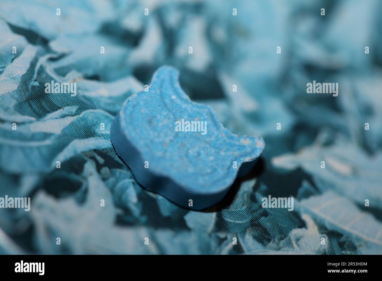 Blue ecstasy owl pill with mdma very strong dope close up background ...