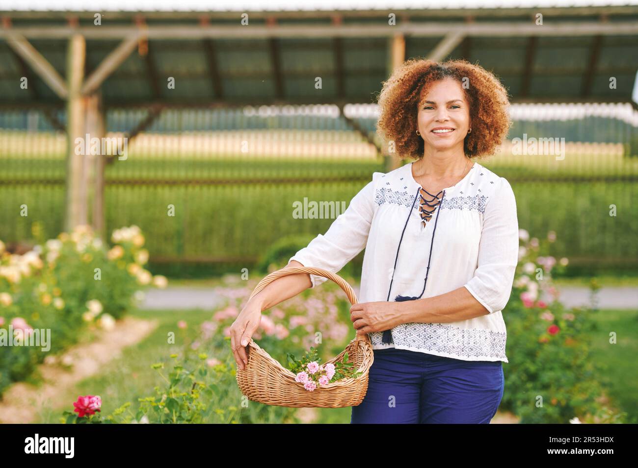 Outdoor Portrait Of Beautiful 50 Year Old Woman Enjoying Nice Day In
