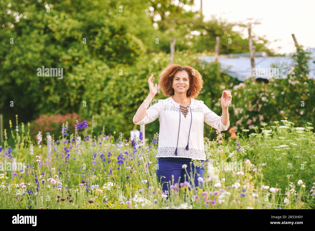 Outdoor Portrait Of Beautiful 50 Year Old Woman Enjoying Nice Day In