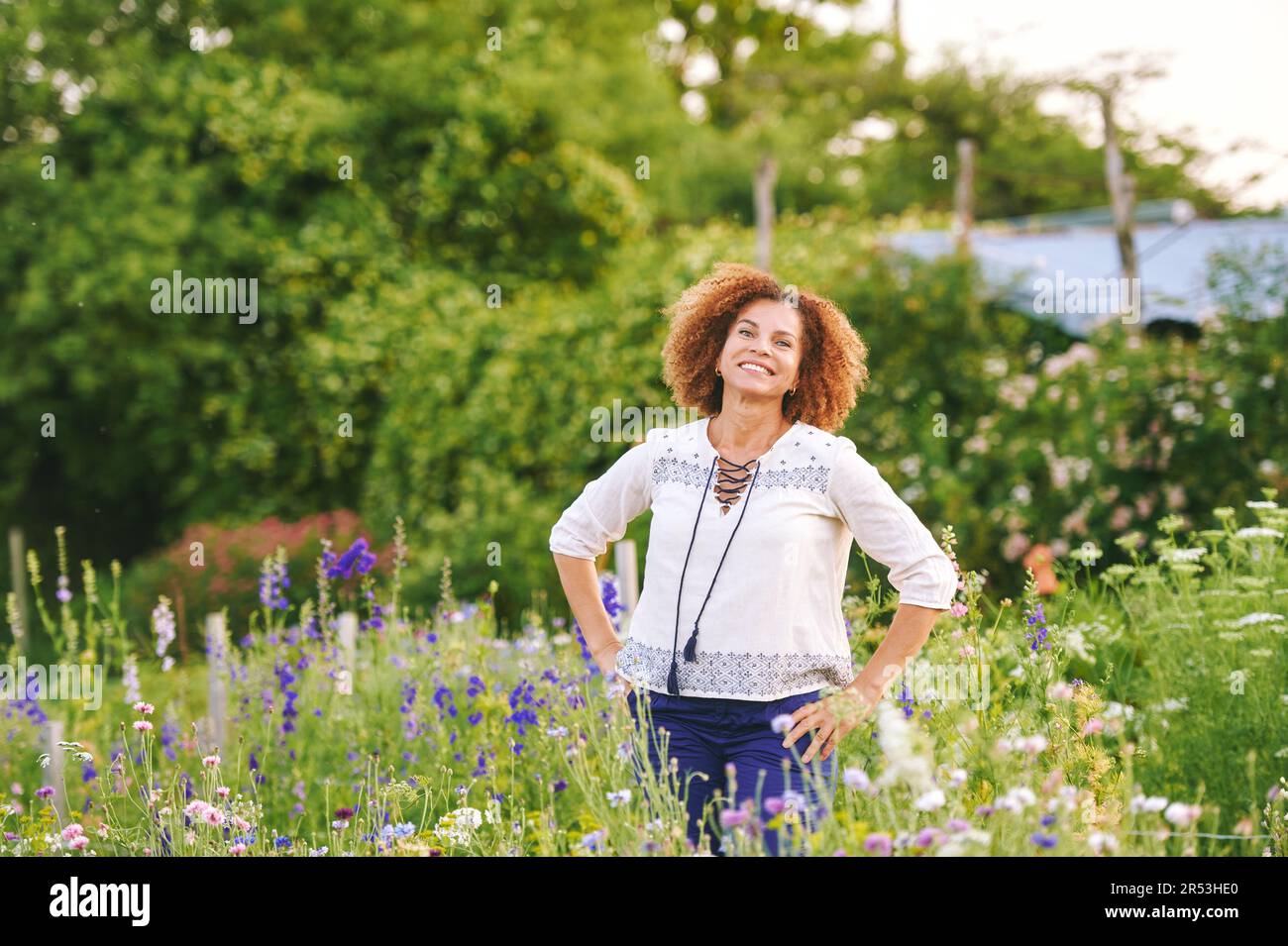 Outdoor Portrait Of Beautiful 50 Year Old Woman Enjoying Nice Day In