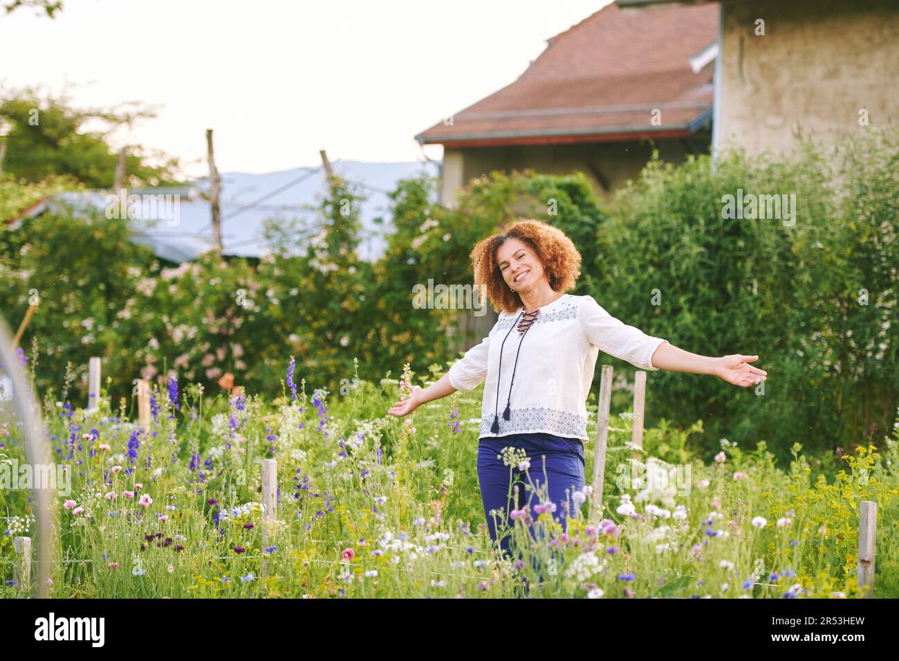 Outdoor Portrait Of Beautiful 50 Year Old Woman Enjoying Nice Day In