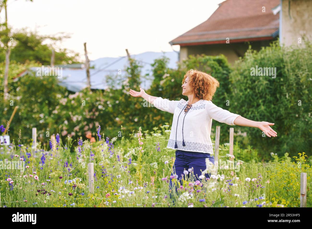 Outdoor Portrait Of Beautiful 50 Year Old Woman Enjoying Nice Day In