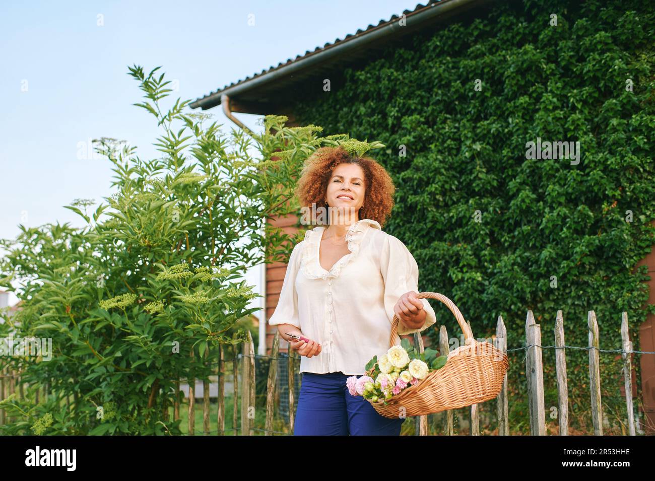 Outdoor Portrait Of Beautiful 50 Year Old Woman Enjoying Nice Day In
