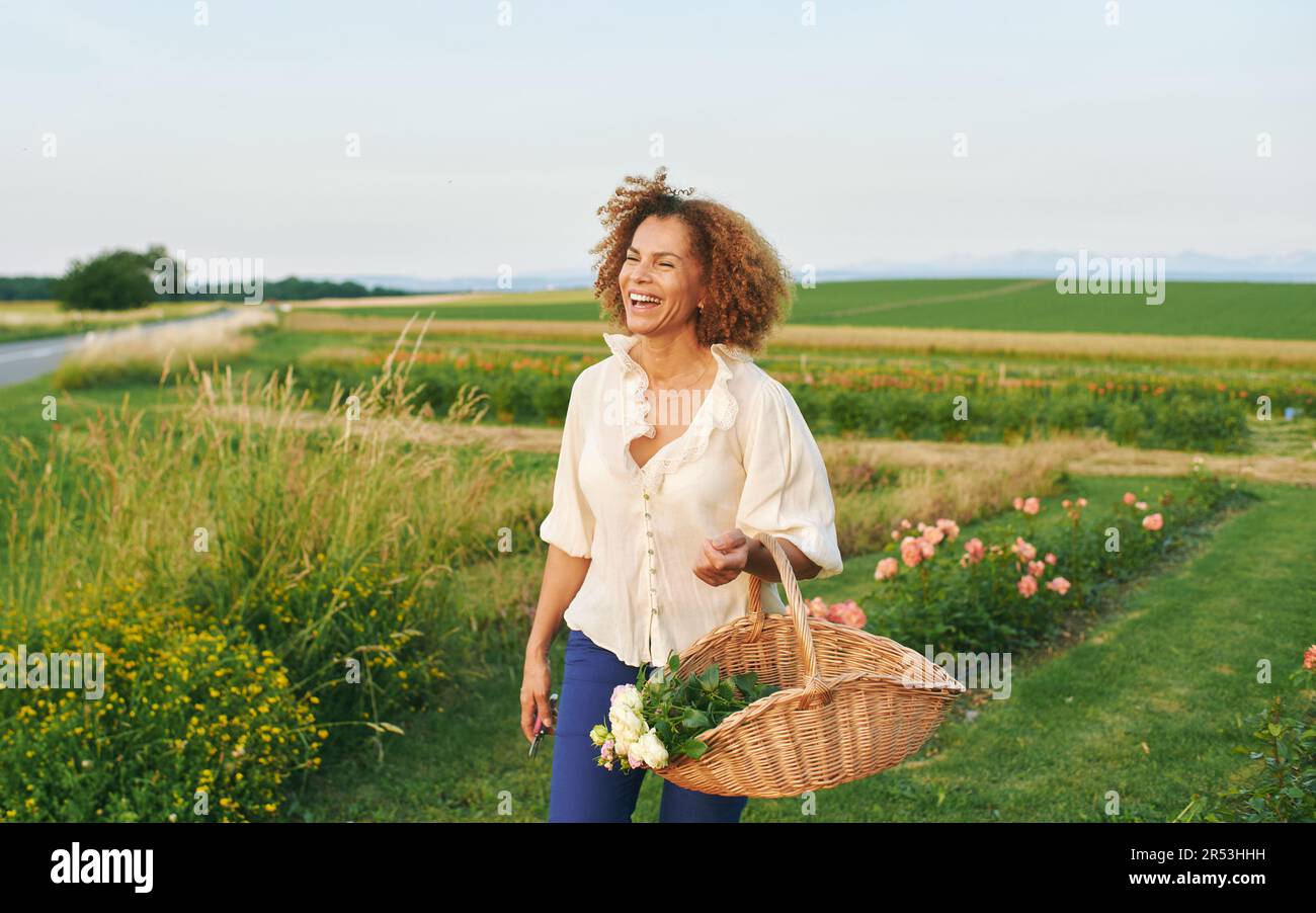 Outdoor Portrait Of Beautiful 50 Year Old Woman Enjoying Nice Day In
