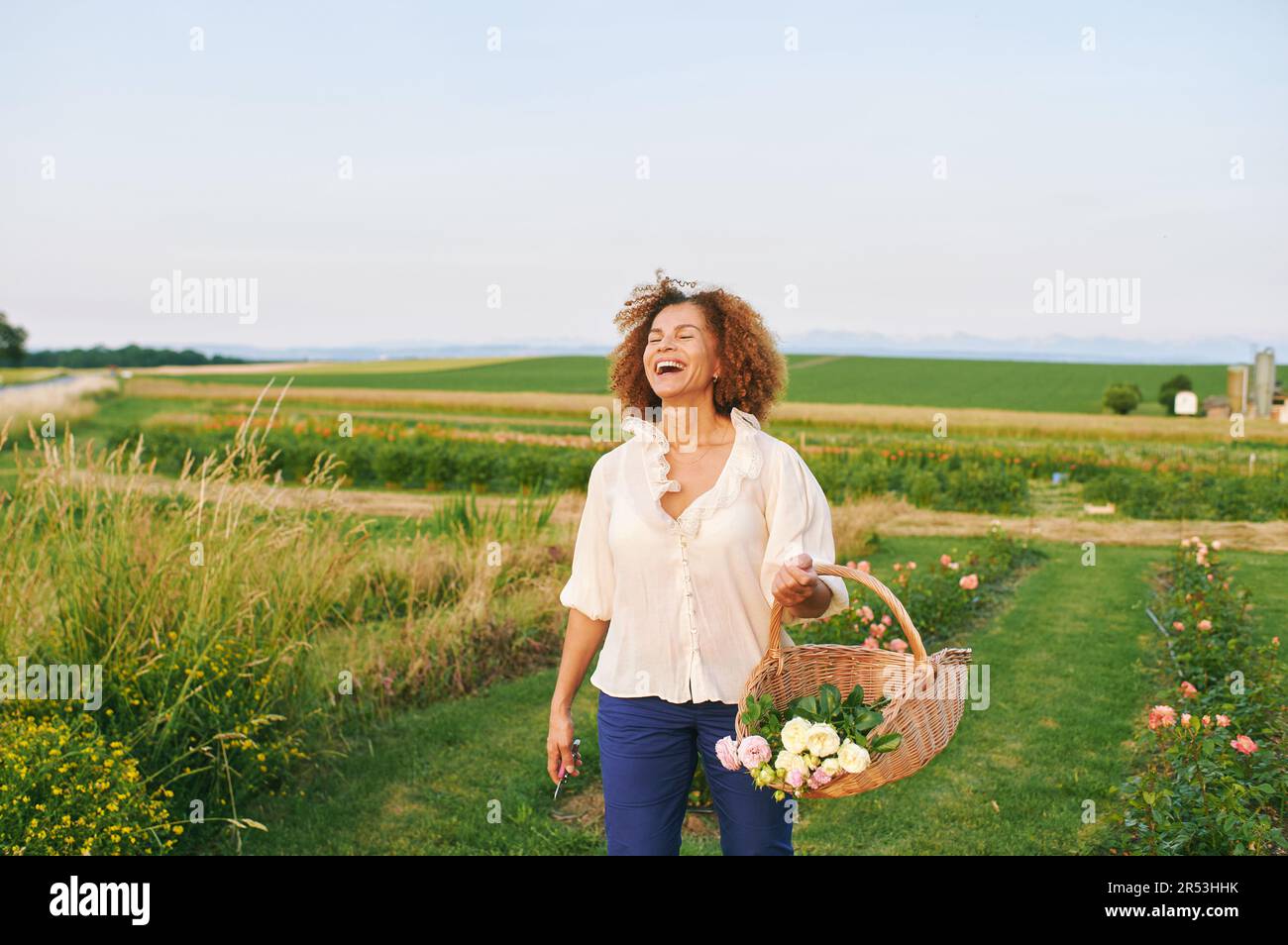 Outdoor Portrait Of Beautiful 50 Year Old Woman Enjoying Nice Day In