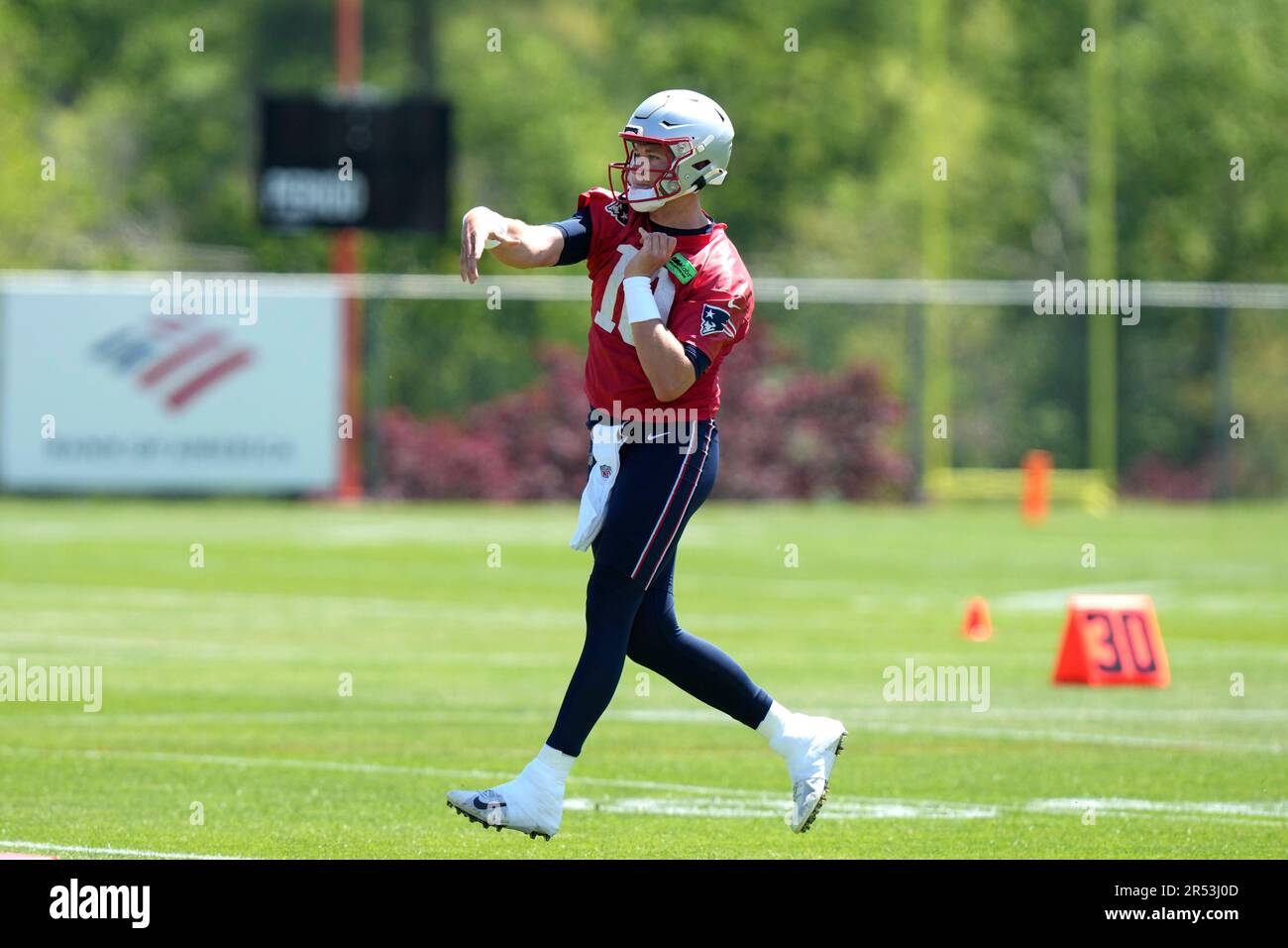 New England Patriots quarterback Mac Jones follows through on a pass ...