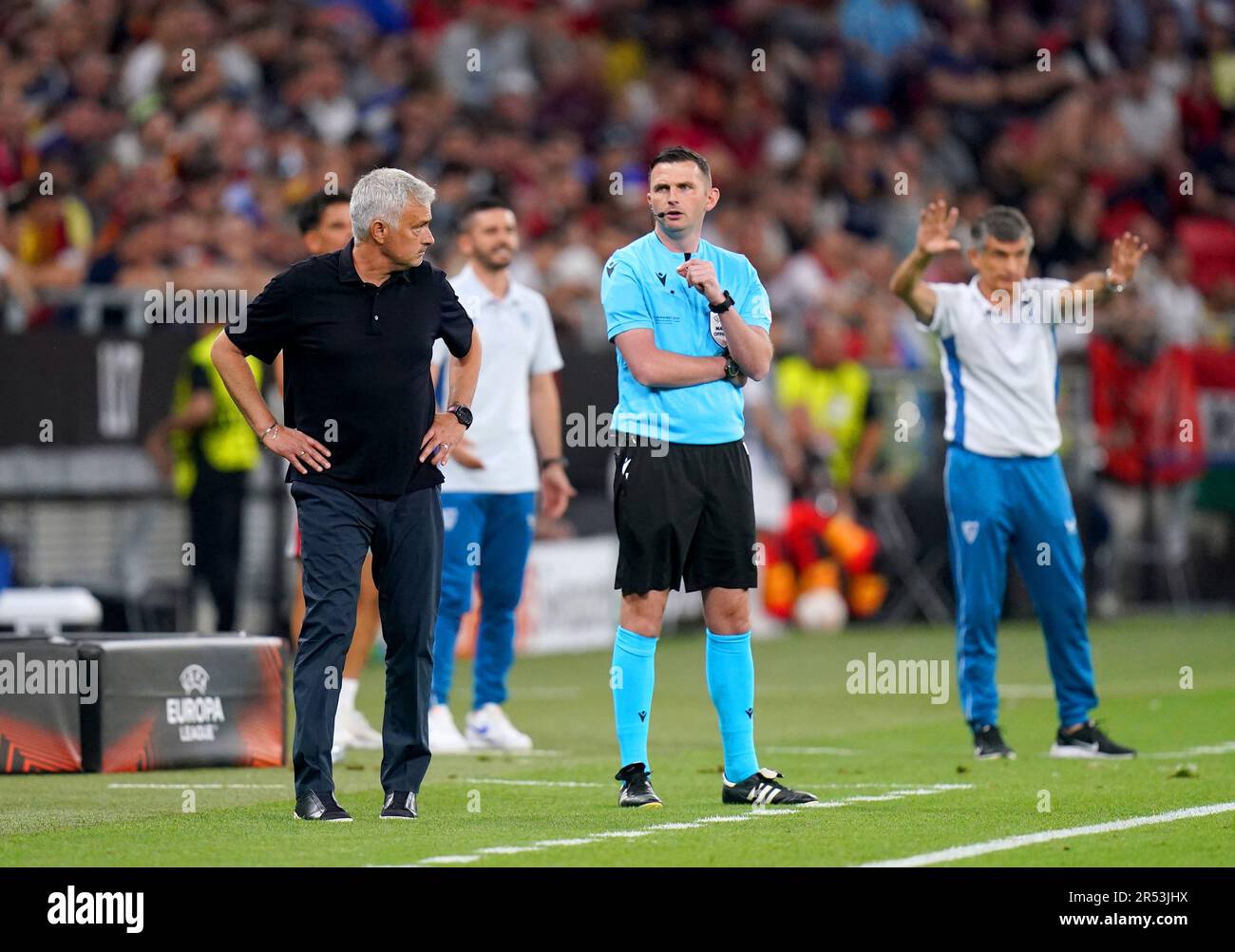 Roma manager Jose Mourinho (left) and fourth official Michael Oliver on ...