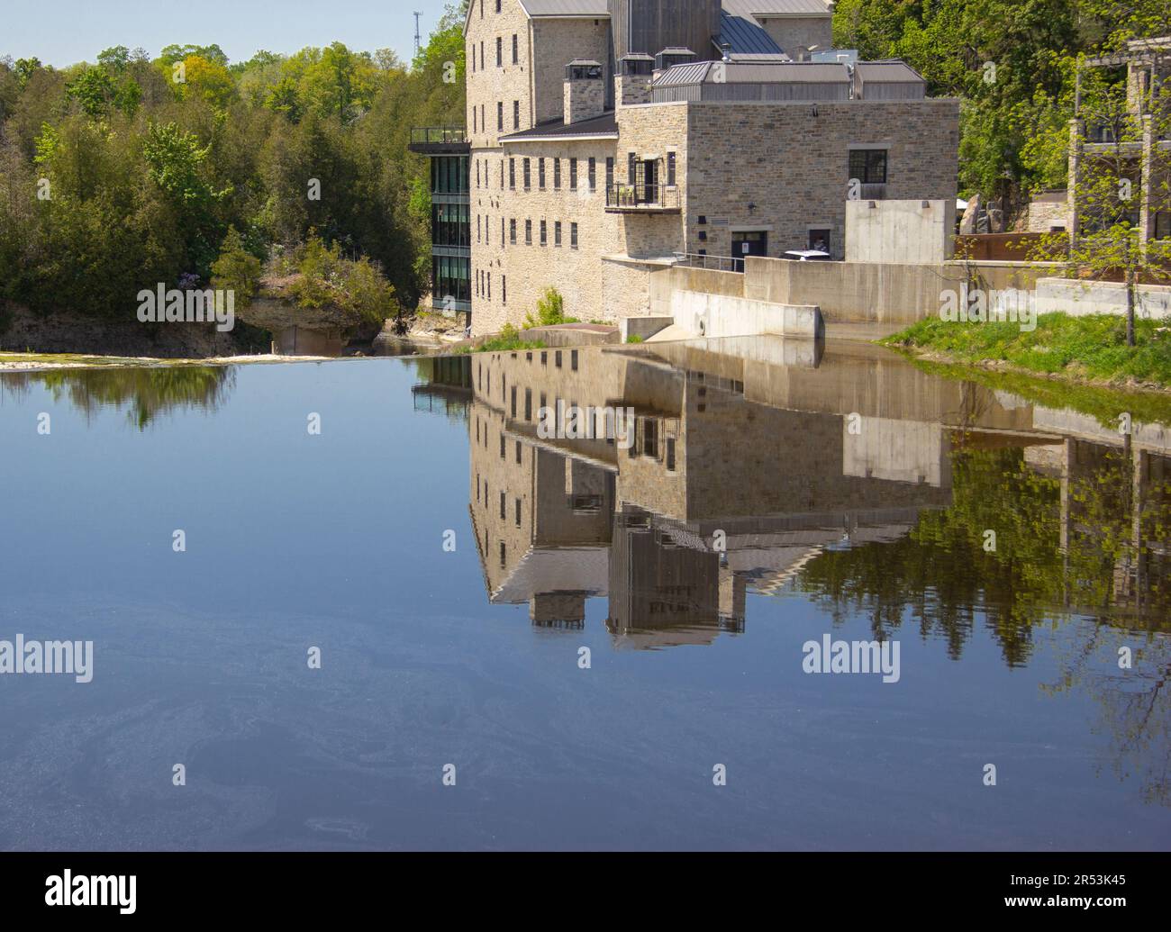 Heritage building reflected in the still water Stock Photo - Alamy
