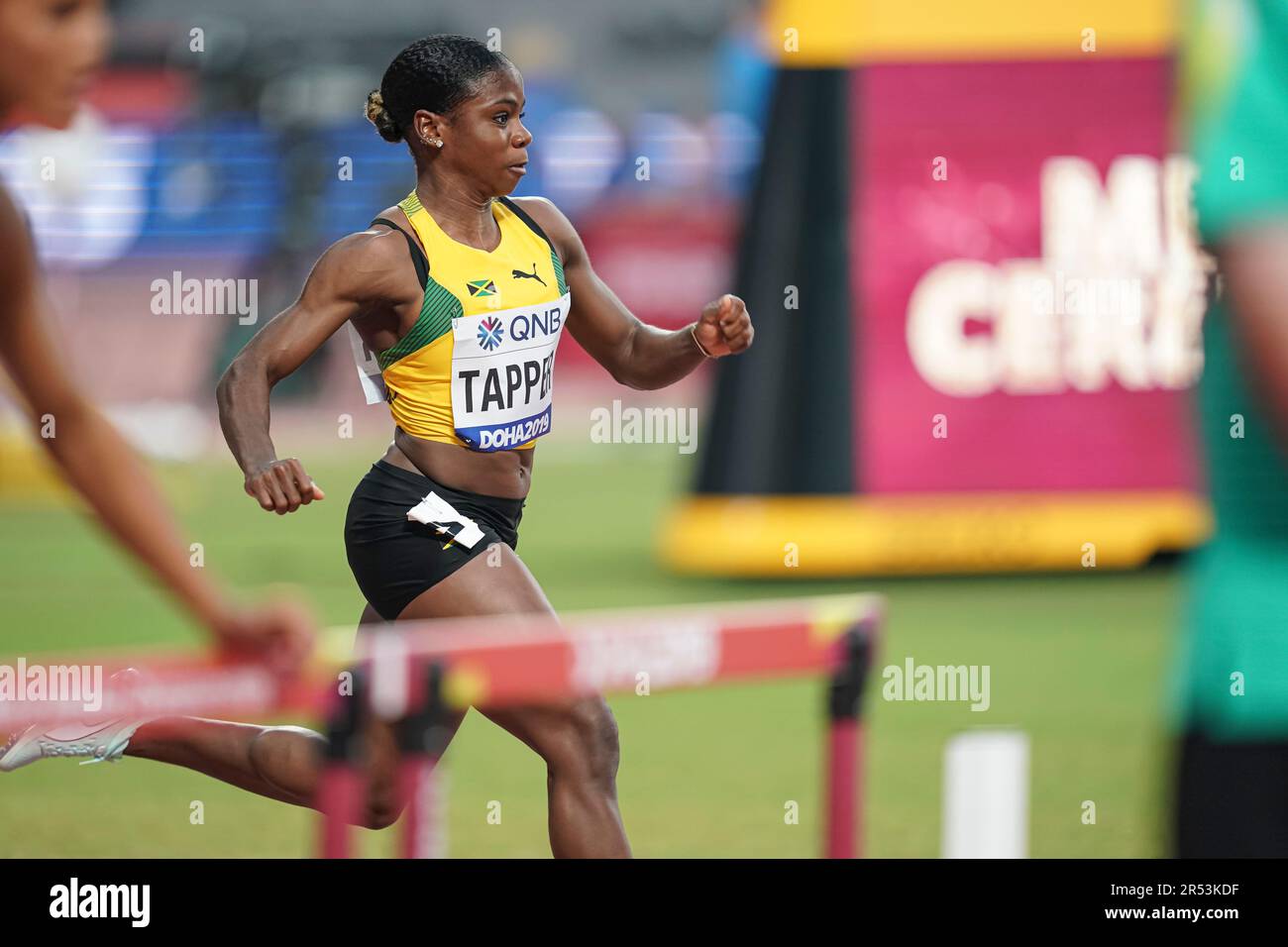 Megan Tapper running the 100m hurdles at the 2019 World Athletics ...