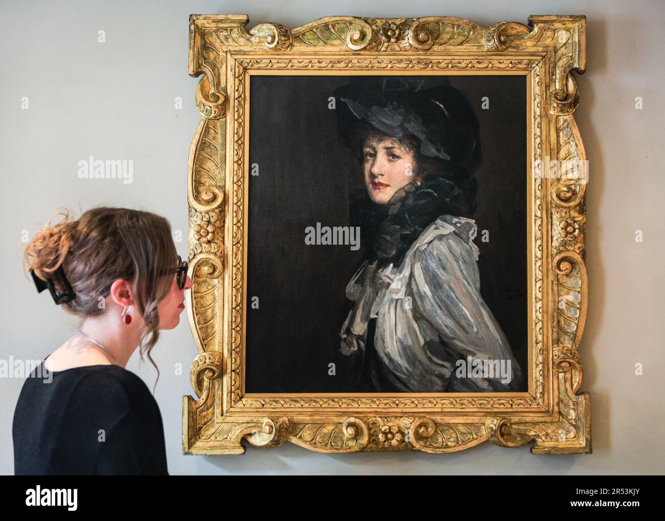 London, UK. 31st May, 2023. Gallery staff with Sir John Lavery ...