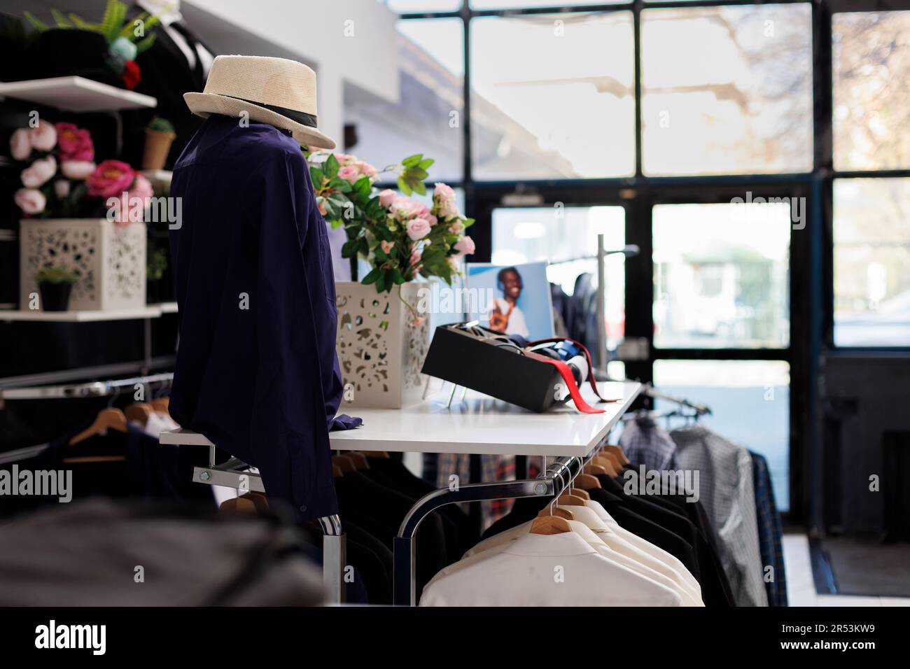 Empty clothing store with casual and formal wear items, retail shop ...