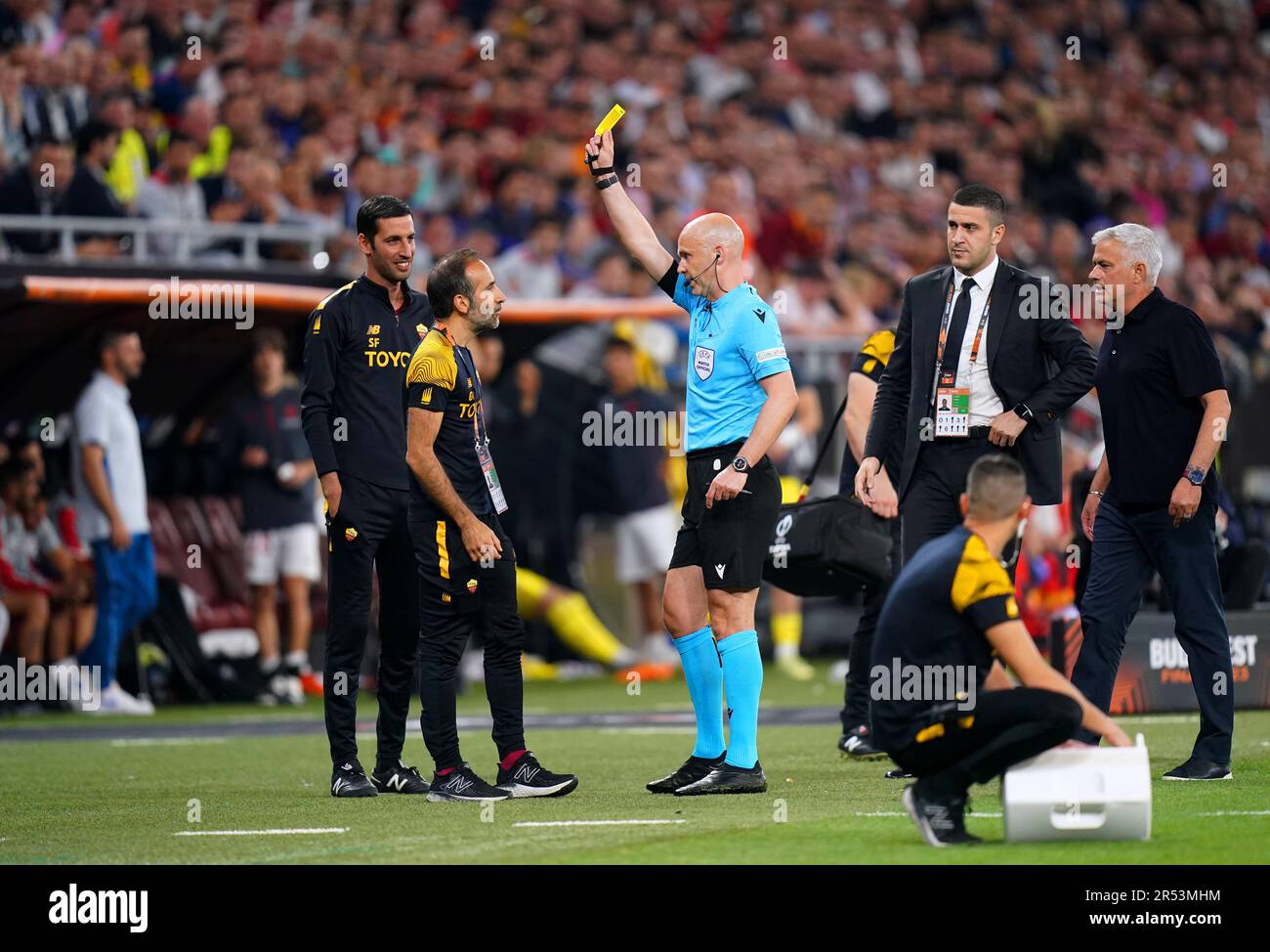 Roma technical coach Giovanni Cerra is shown a yellow card by referee ...