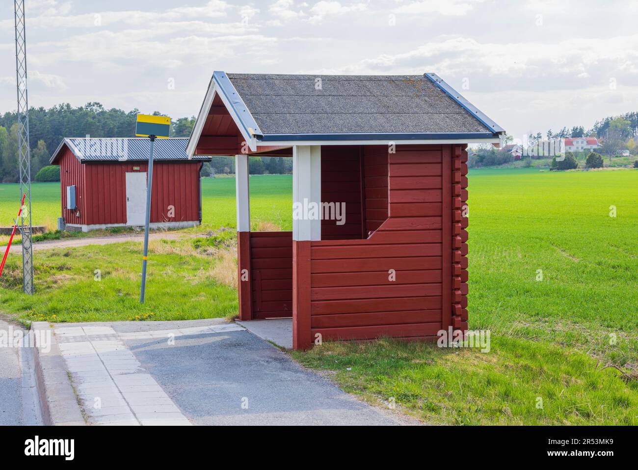 Close-up view of red wooden bus stop on countryside. Sweden. Europe ...