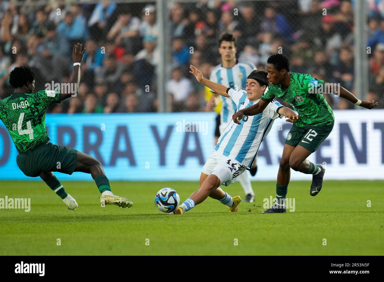 Argentina's Luka Romero, center, fights for the ball against Nigeria's ...