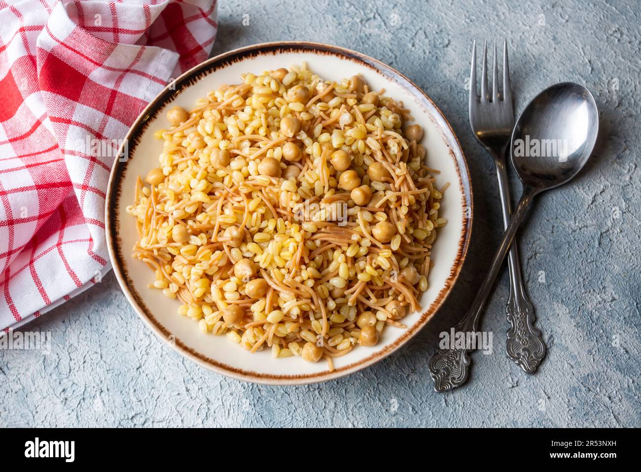 Traditional delicious Turkish food; bulgur pilaf with chickpea (Turkish ...