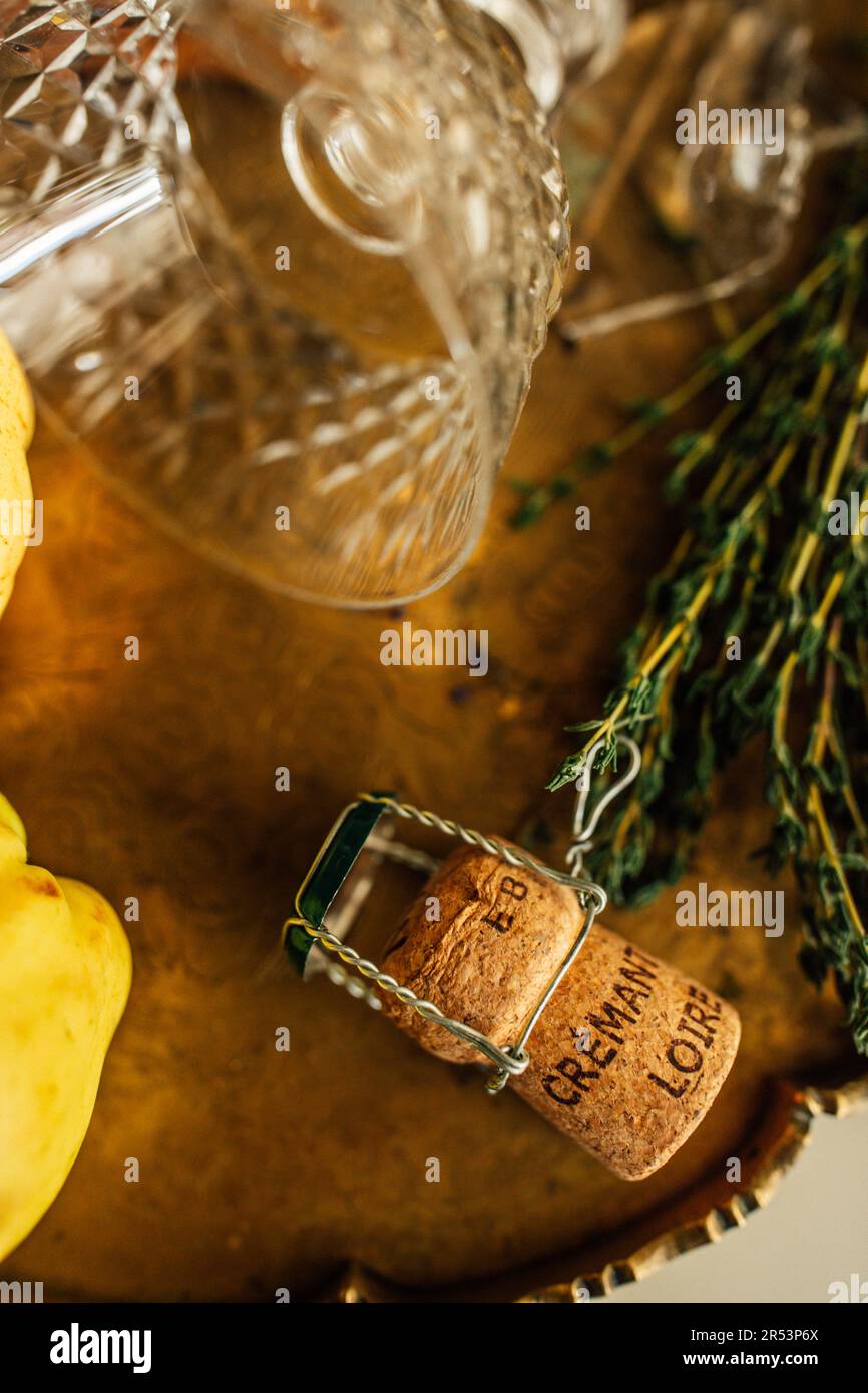 Cremate loire champagne cork and cage on brass tray with bunch of thyme ...