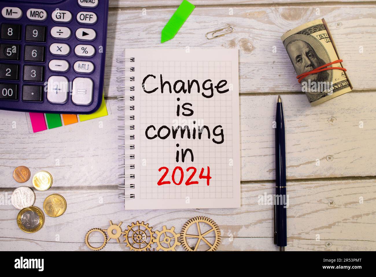 CHANGE COMING IN 2024. red and black font on white paper on the table ...