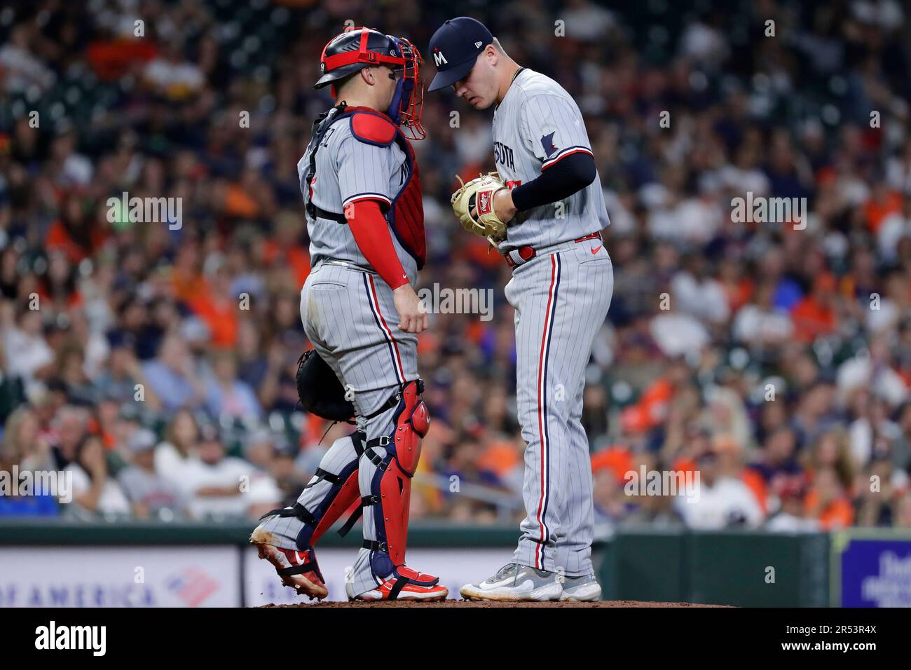Minnesota Twins catcher Christian Vazquez, left, and pitcher Cole Sands ...